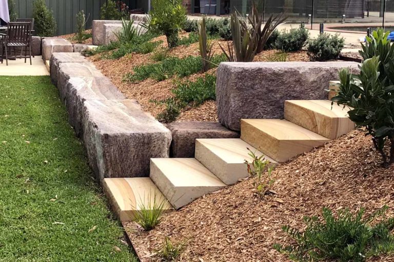 Sandstone Log Retaining Walls | The Landscaped Garden