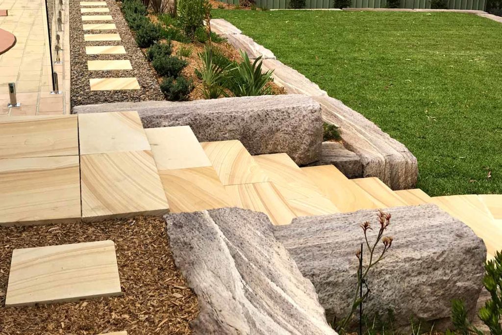 Sandstone Log Retaining Walls | The Landscaped Garden